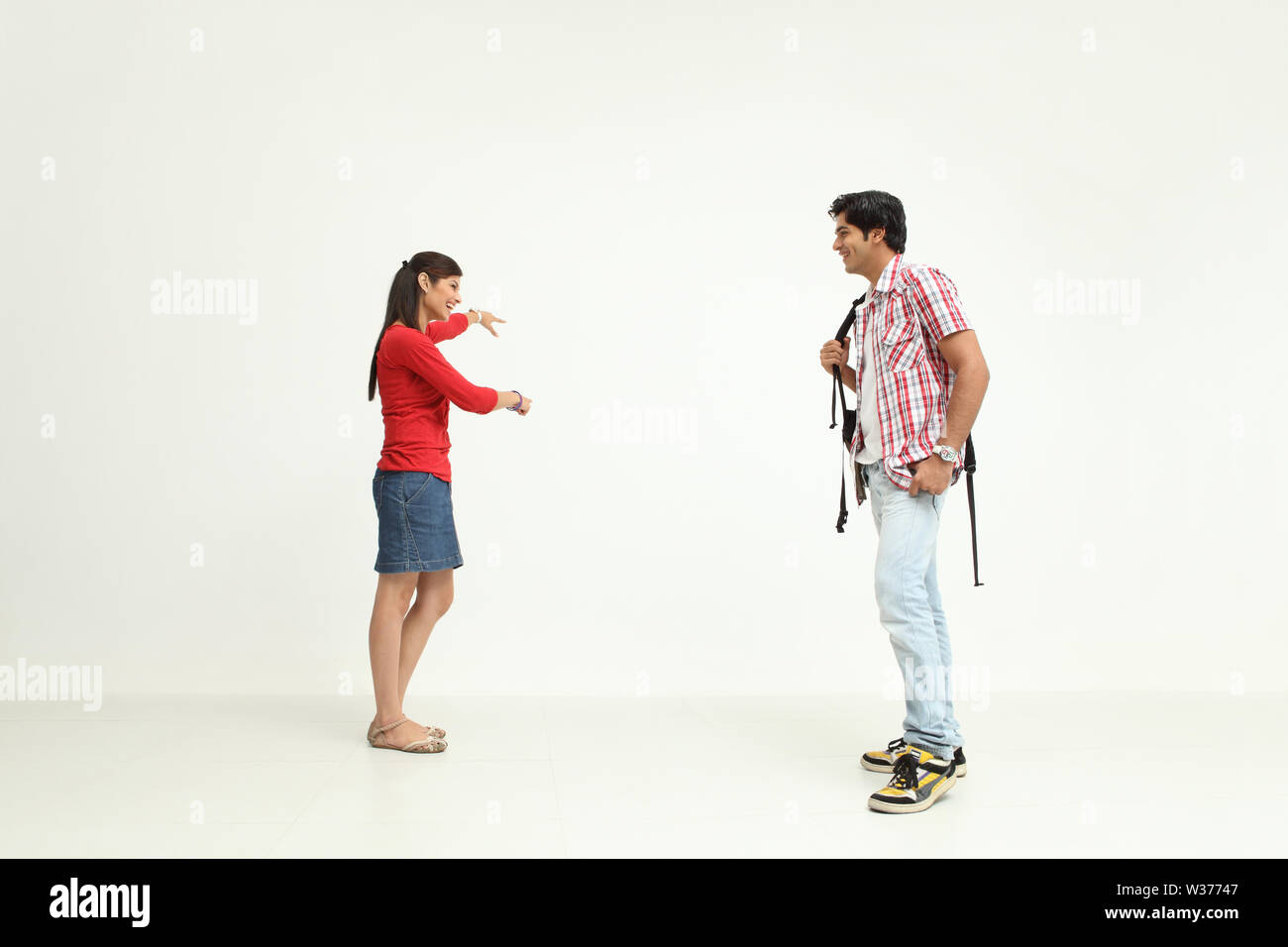 Woman explaining something to her husband Stock Photo - Alamy