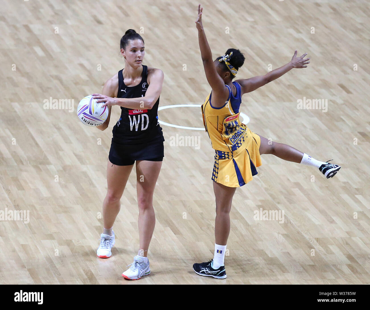 New Zealand's Karin Burger (left) and Barbados' Damisha Croney battle ...