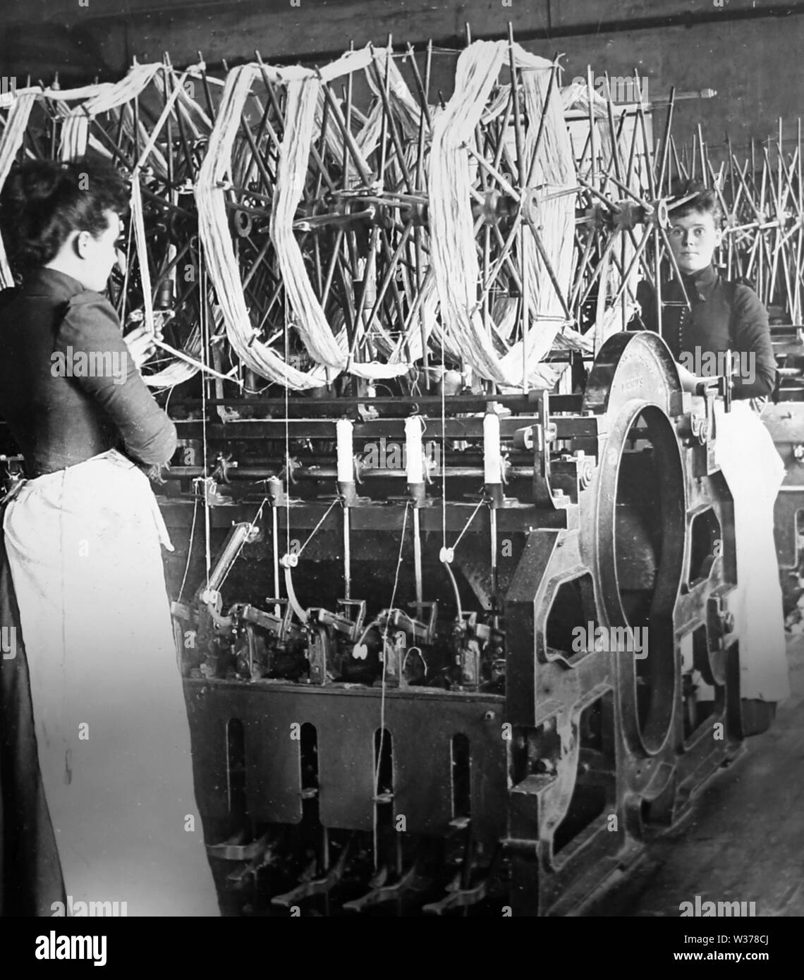 Linen manufacture, Cop winding machine Stock Photo - Alamy