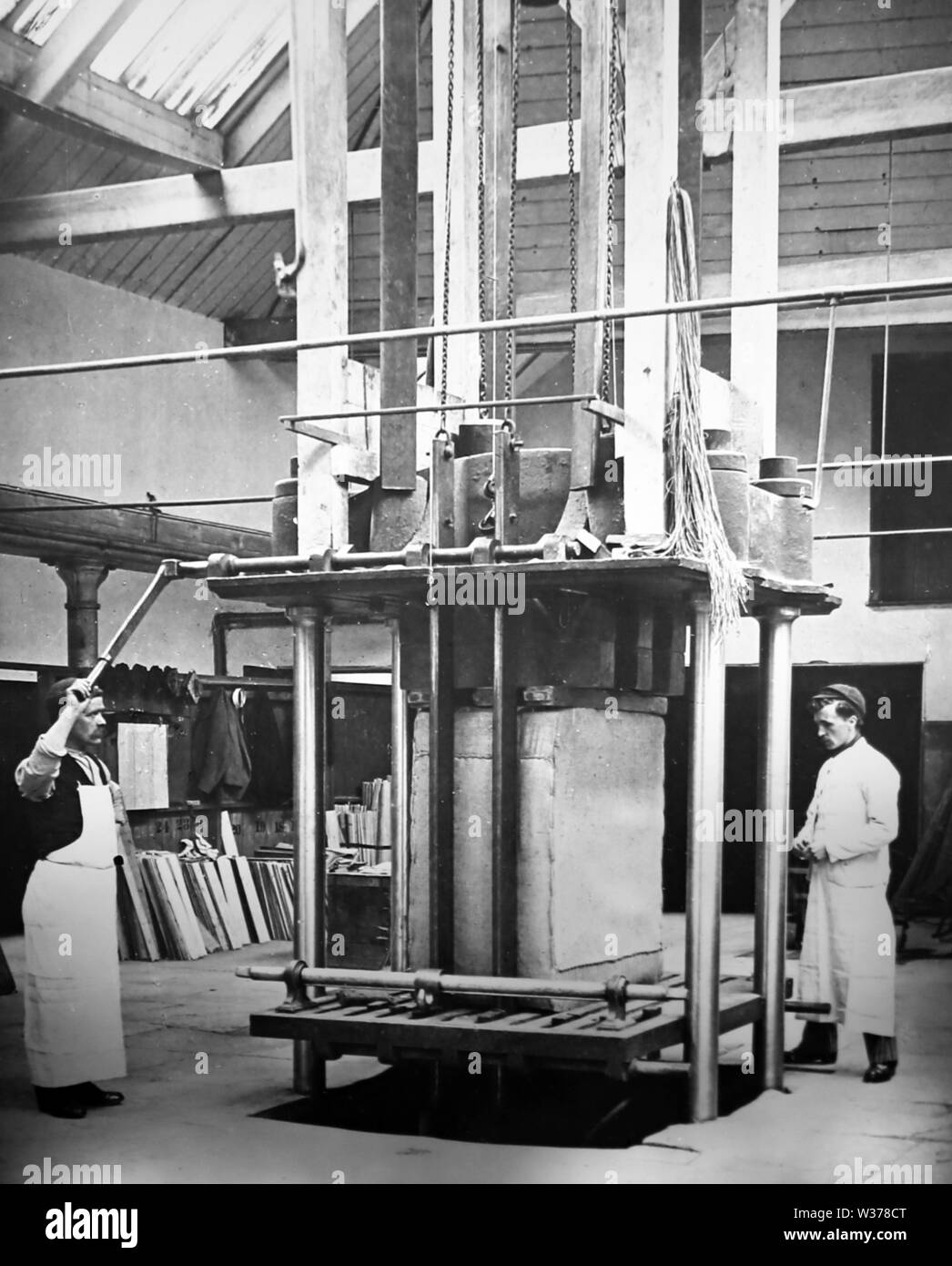 Linen manufacture, Pressing bale of linen Stock Photo - Alamy