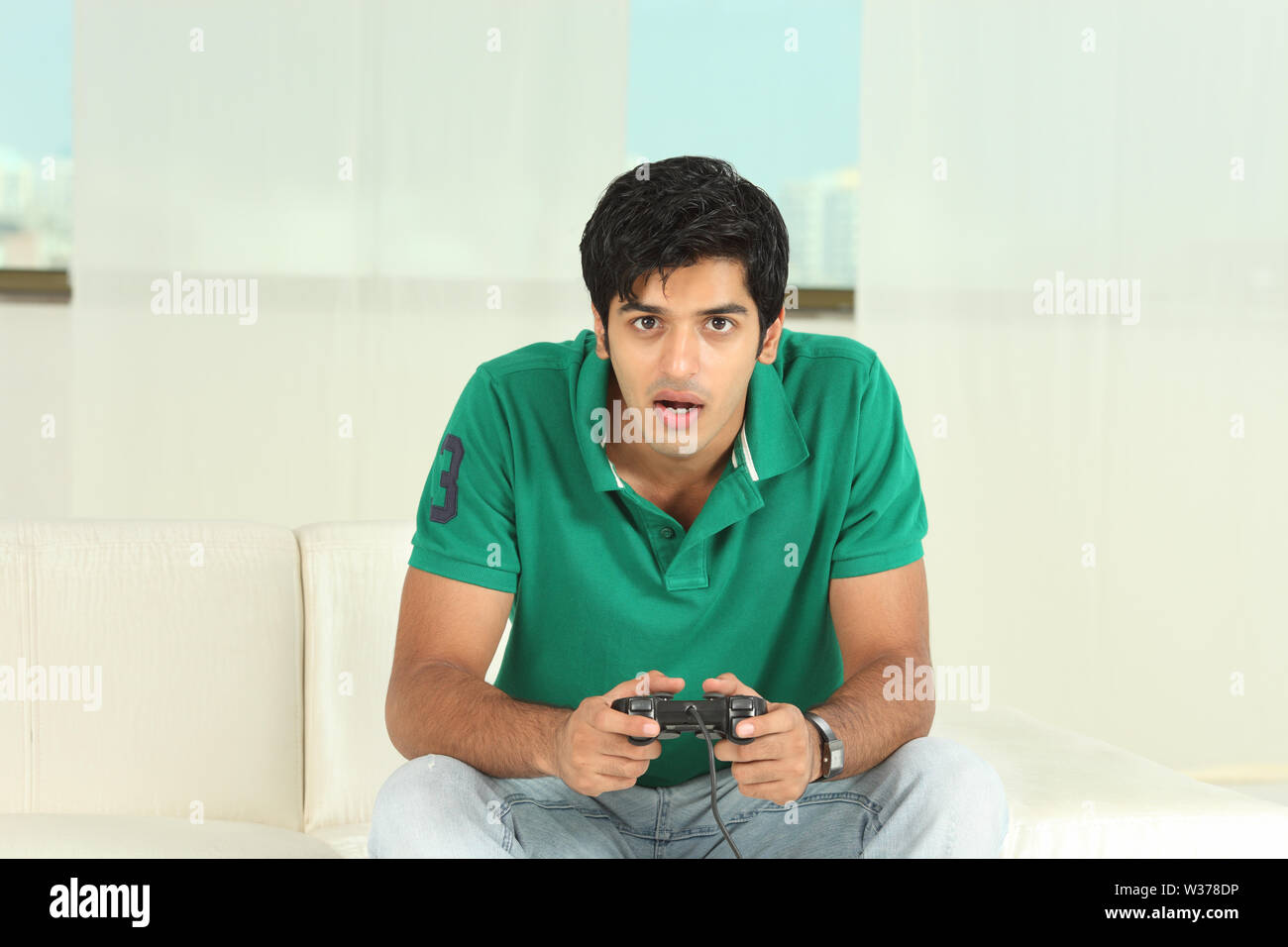 Man playing video game Stock Photo - Alamy