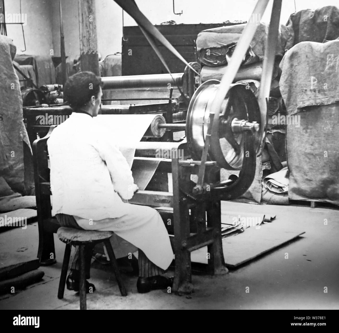 Linen manufacture, Web rolling machine Stock Photo - Alamy