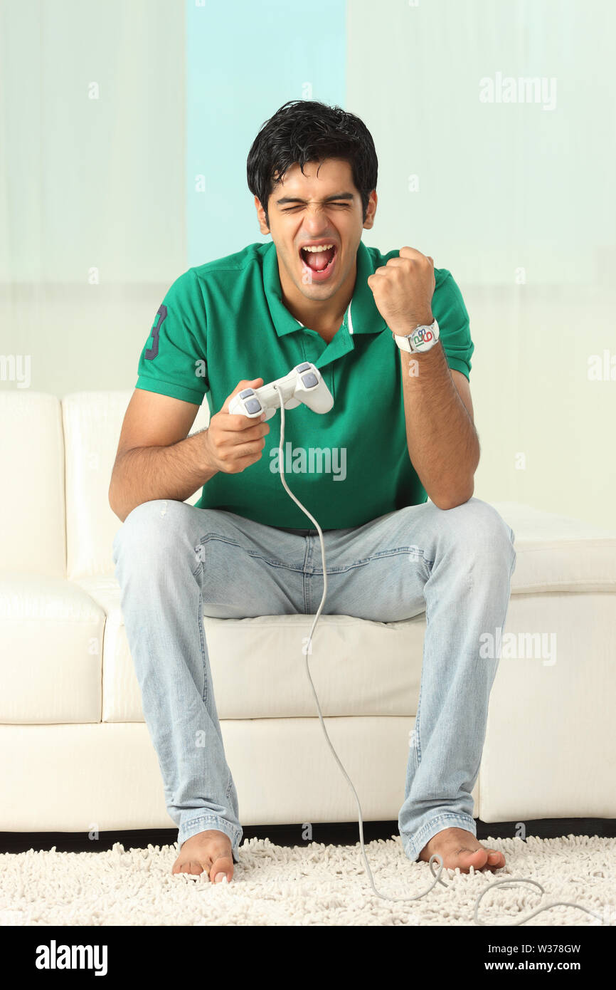 Man playing video game Stock Photo - Alamy