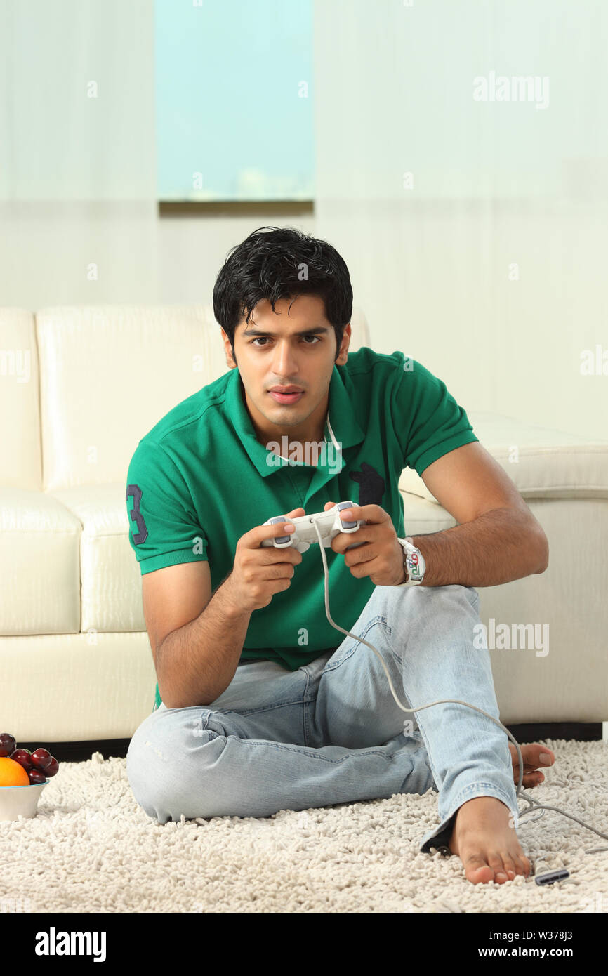 Man playing video game Stock Photo - Alamy