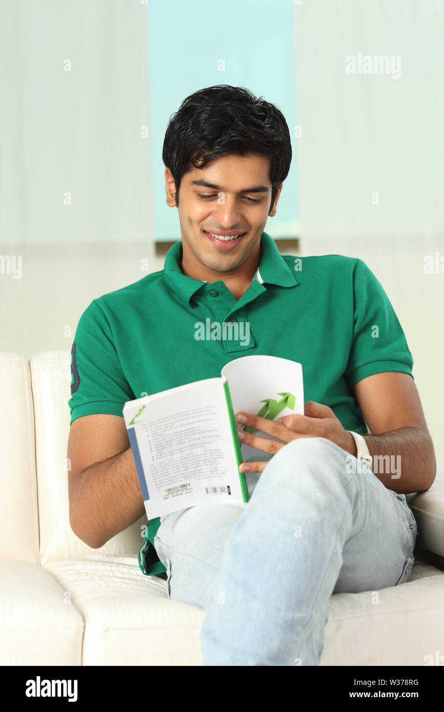 Man reading a book Stock Photo - Alamy