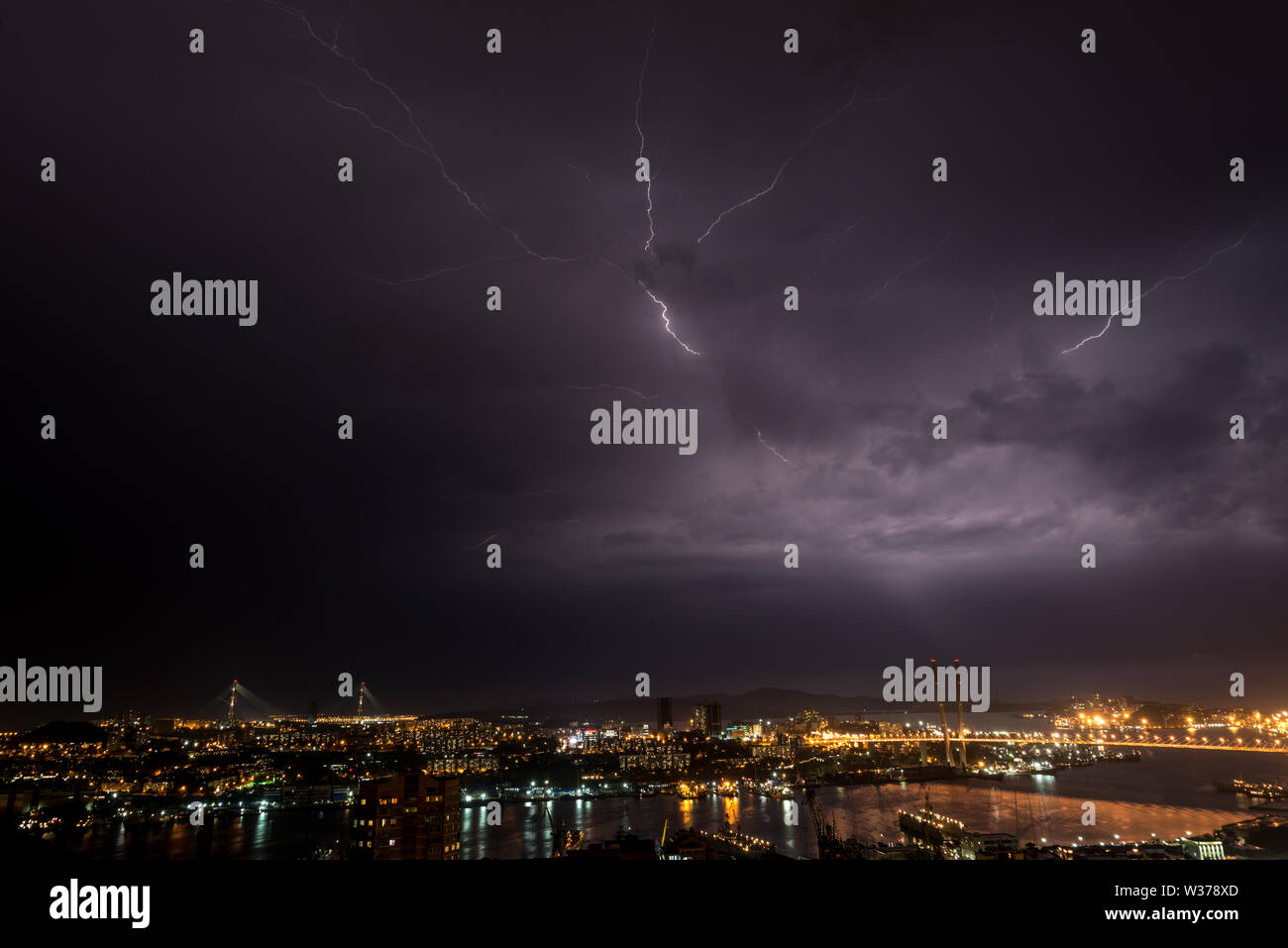 Lightning storm over city Stock Photo - Alamy