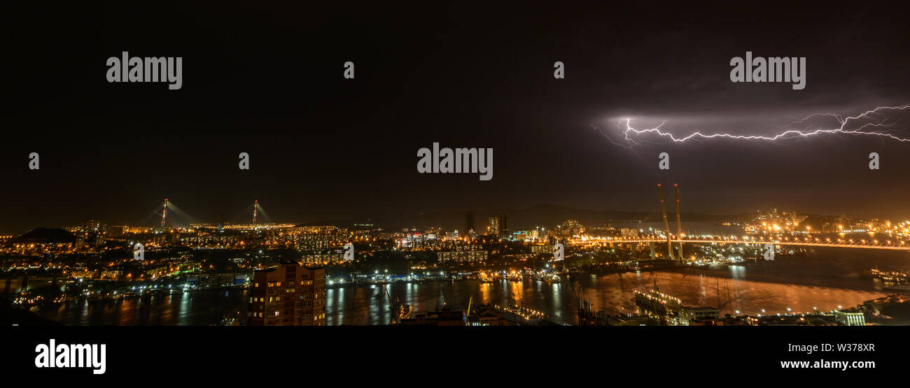 Lightning storm over city Stock Photo - Alamy