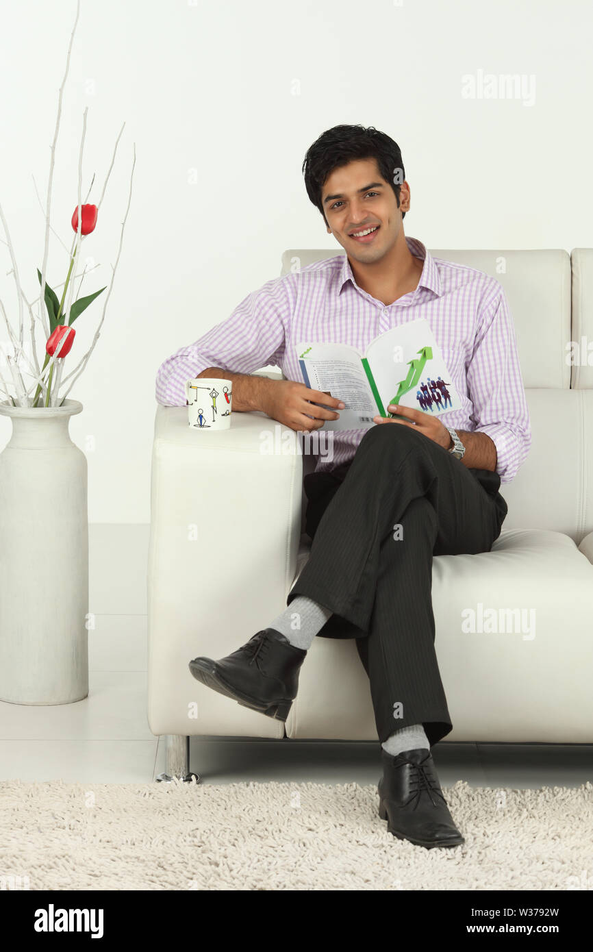 Man reading a book Stock Photo - Alamy