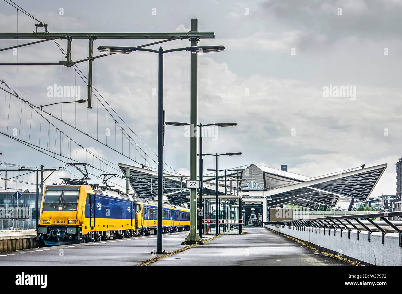 Tilburg, The Netherlands, July 12, 2019: yellow and blue Dutch Railways ...