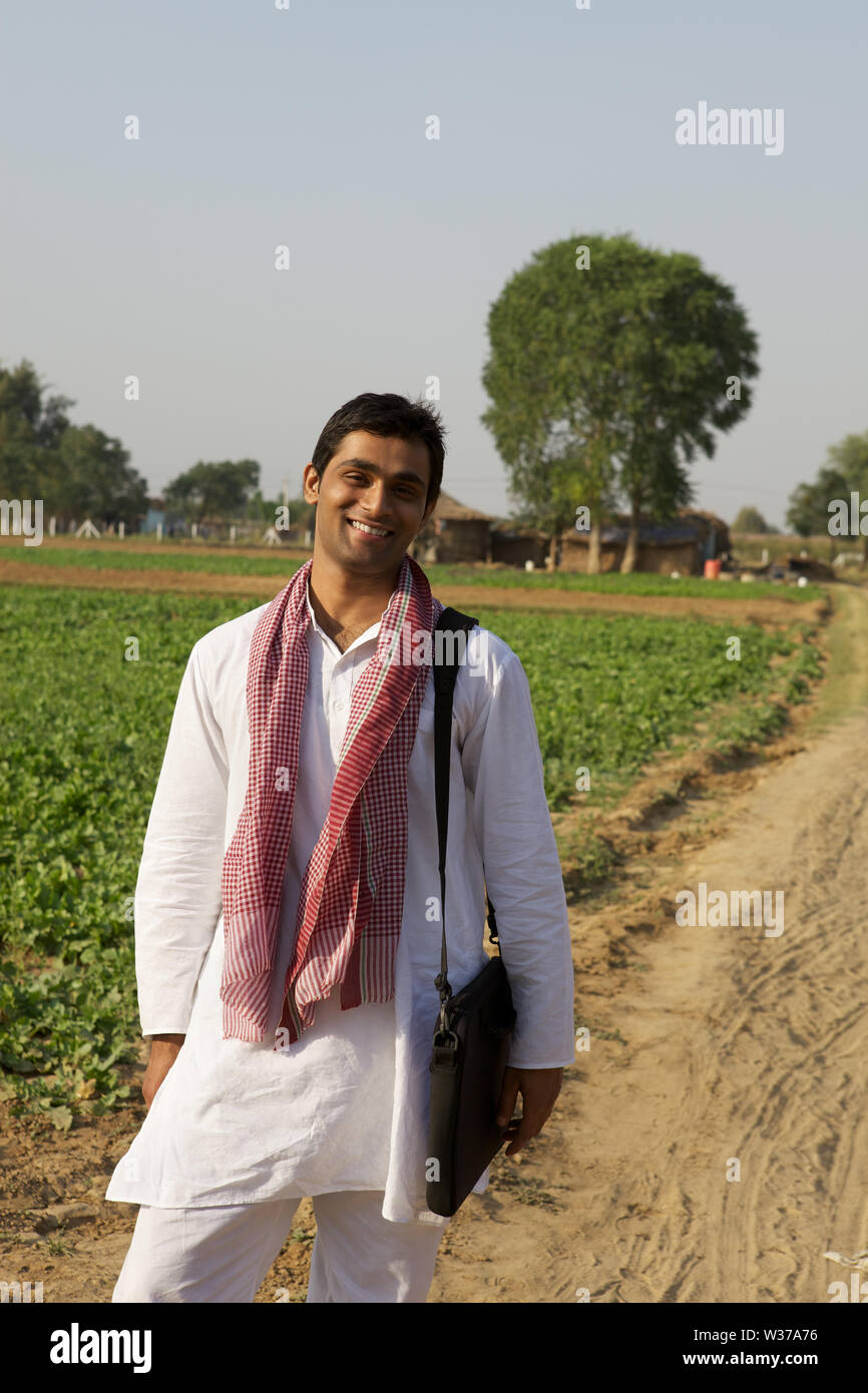 Portrait of a farmer smiling Stock Photo - Alamy
