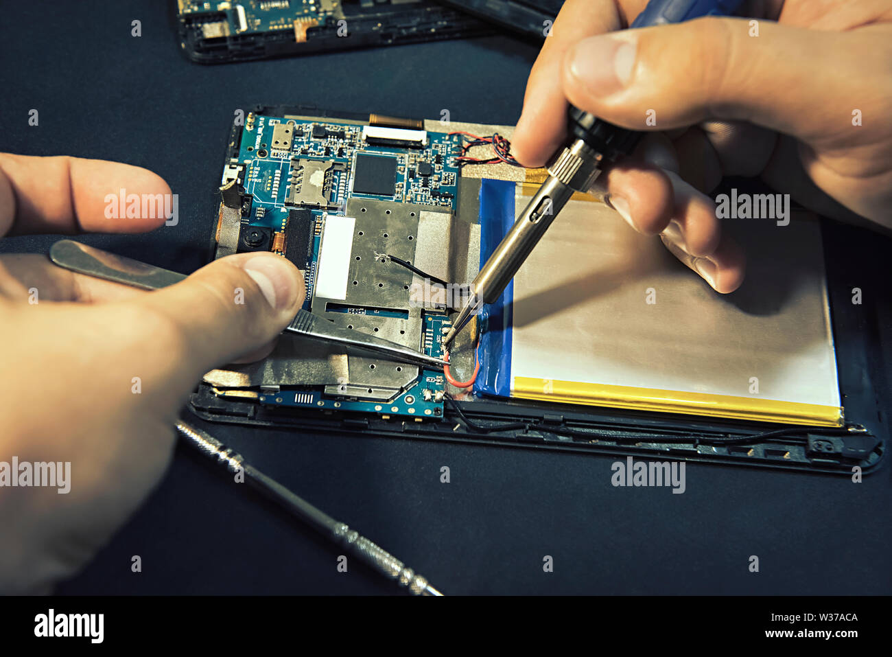 Repair of the battery hi-res stock photography and images - Alamy