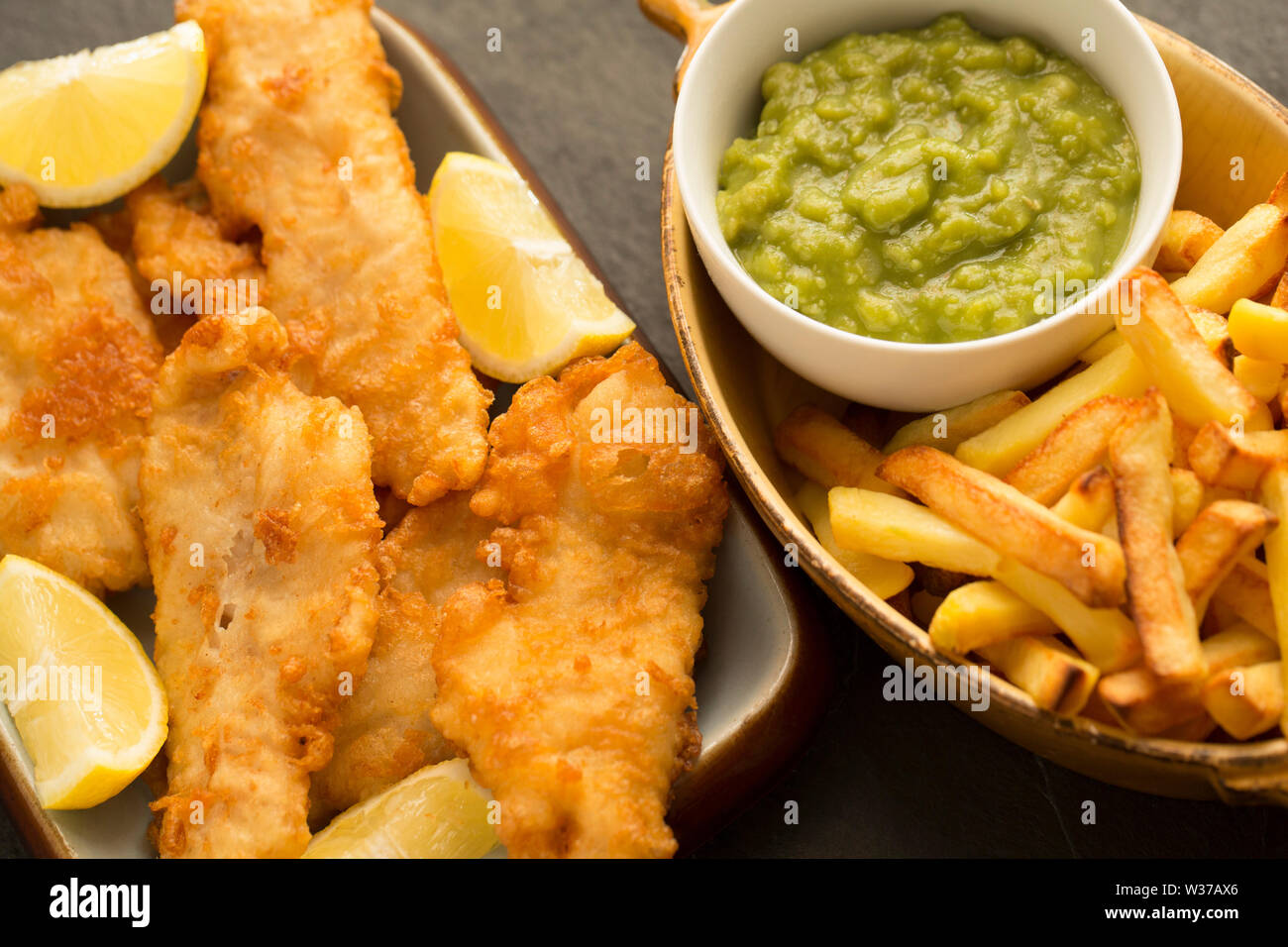 Fillets of deep fried pouting, Trisopterus luscus, that have been ...