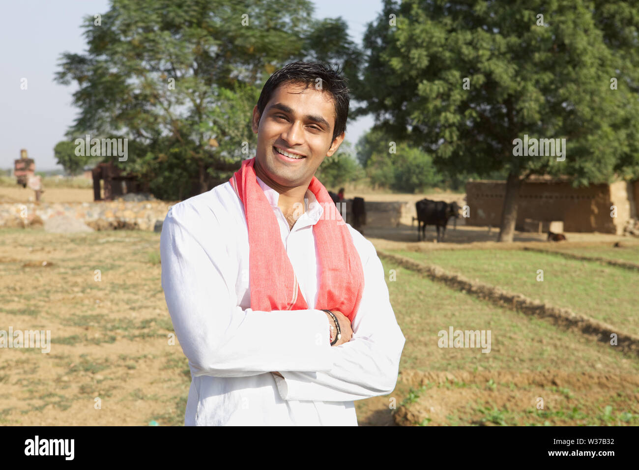 Portrait of a farmer smiling in a field Stock Photo - Alamy