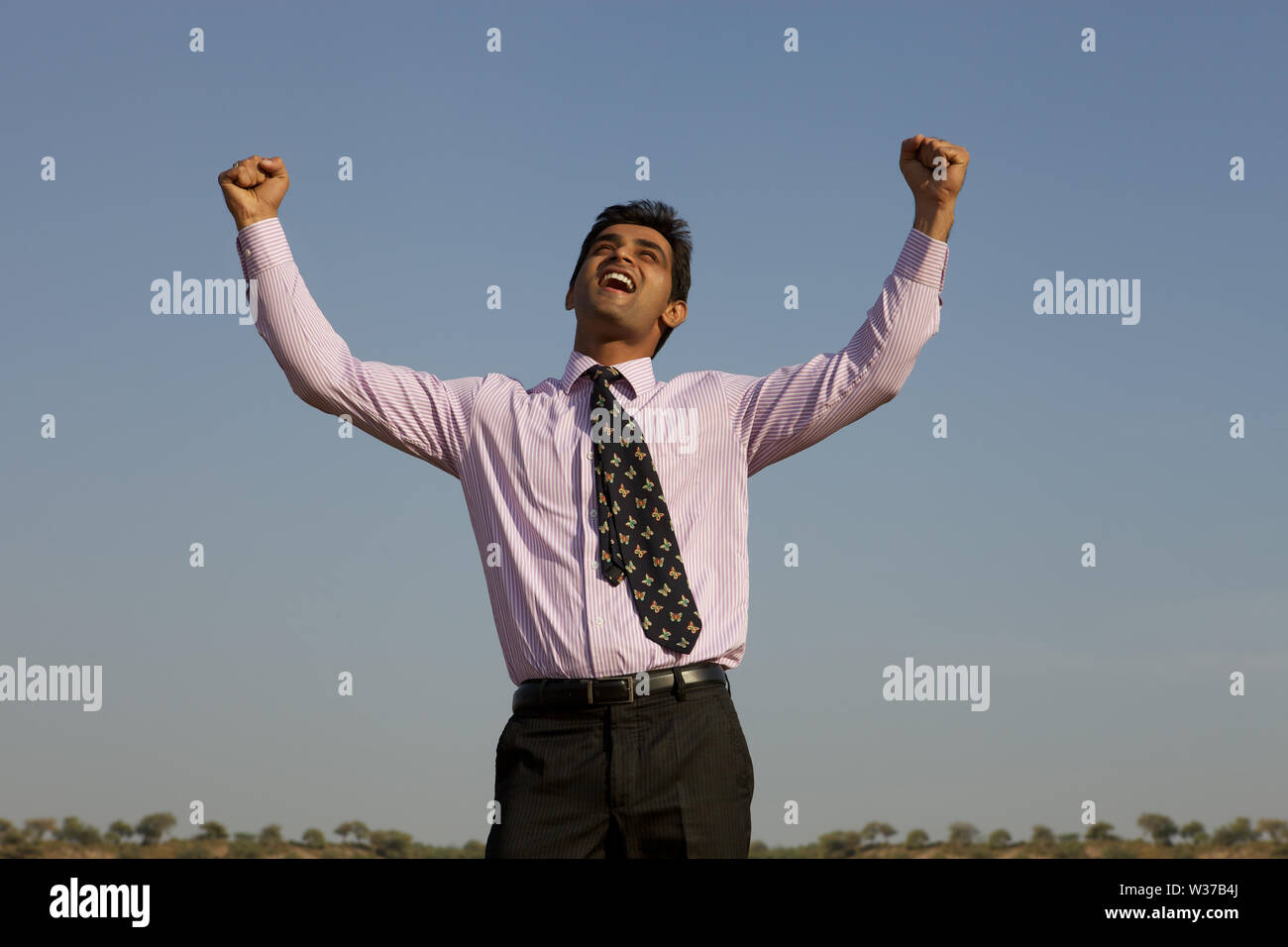 Businessman standing with his arm outstretched Stock Photo - Alamy