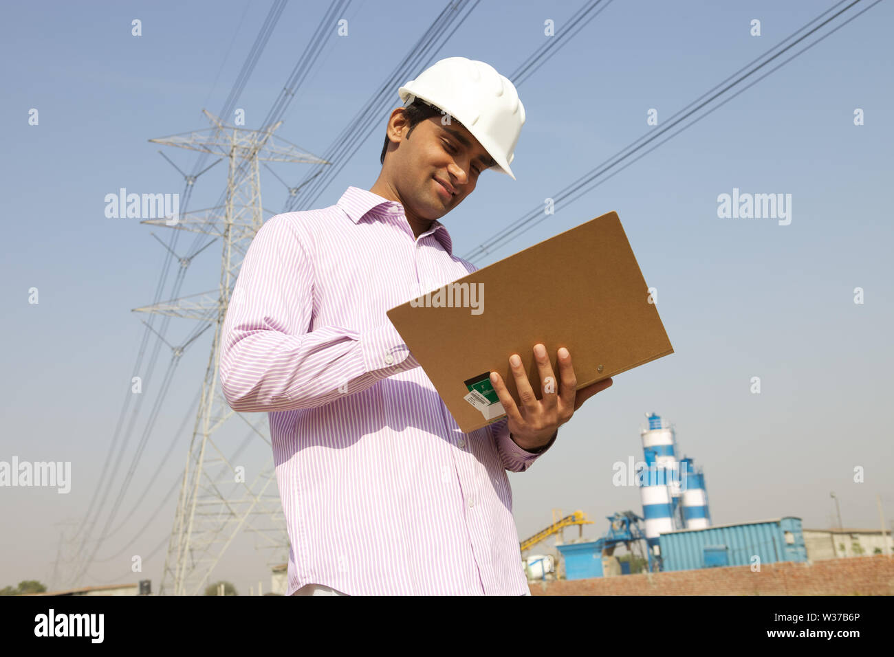 Engineer doing paperwork Stock Photo - Alamy