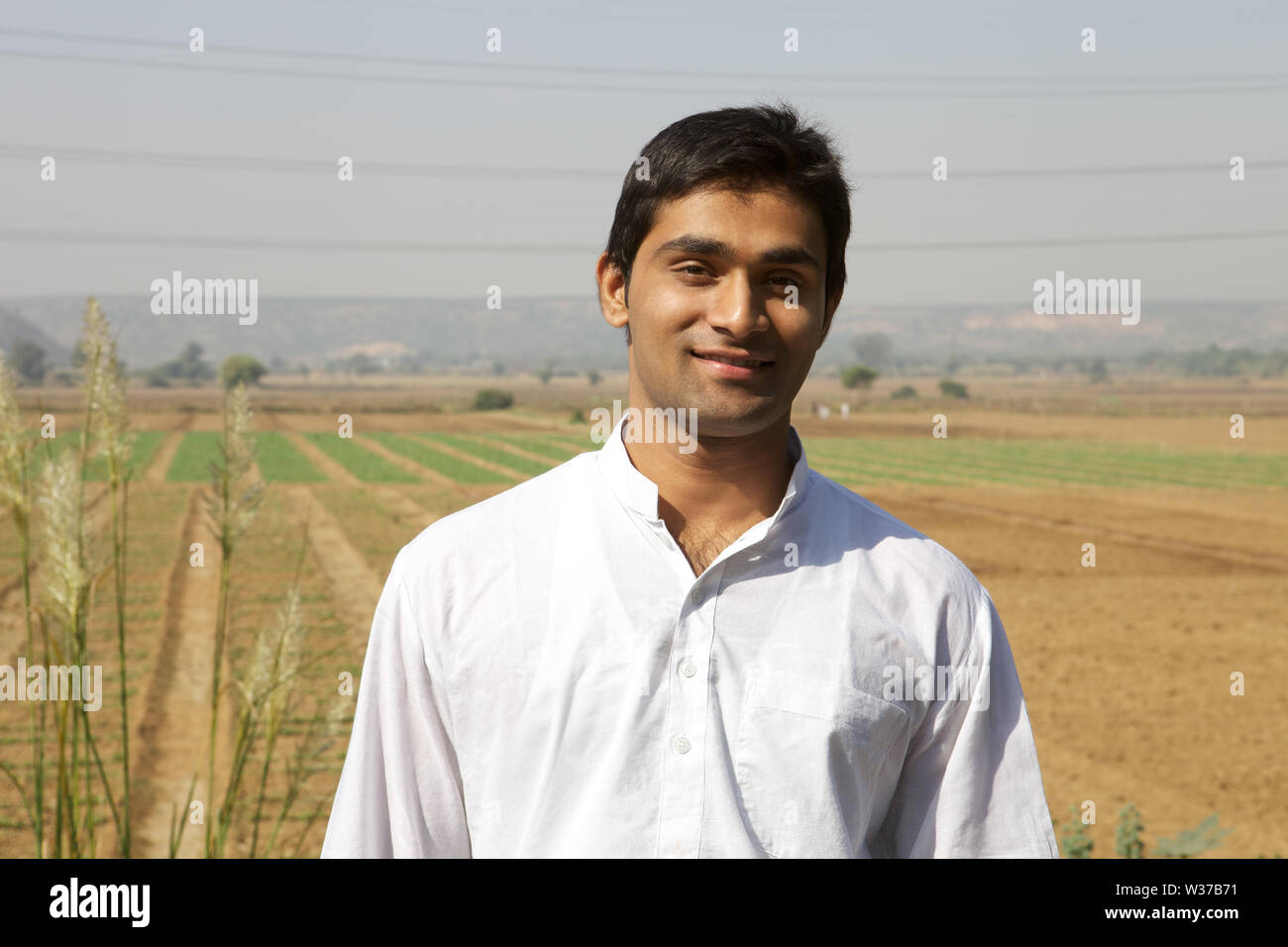 Portrait of a farmer smiling Stock Photo - Alamy