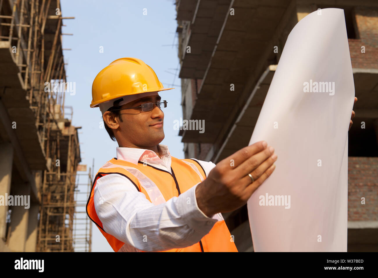 Architect at construction site Stock Photo - Alamy