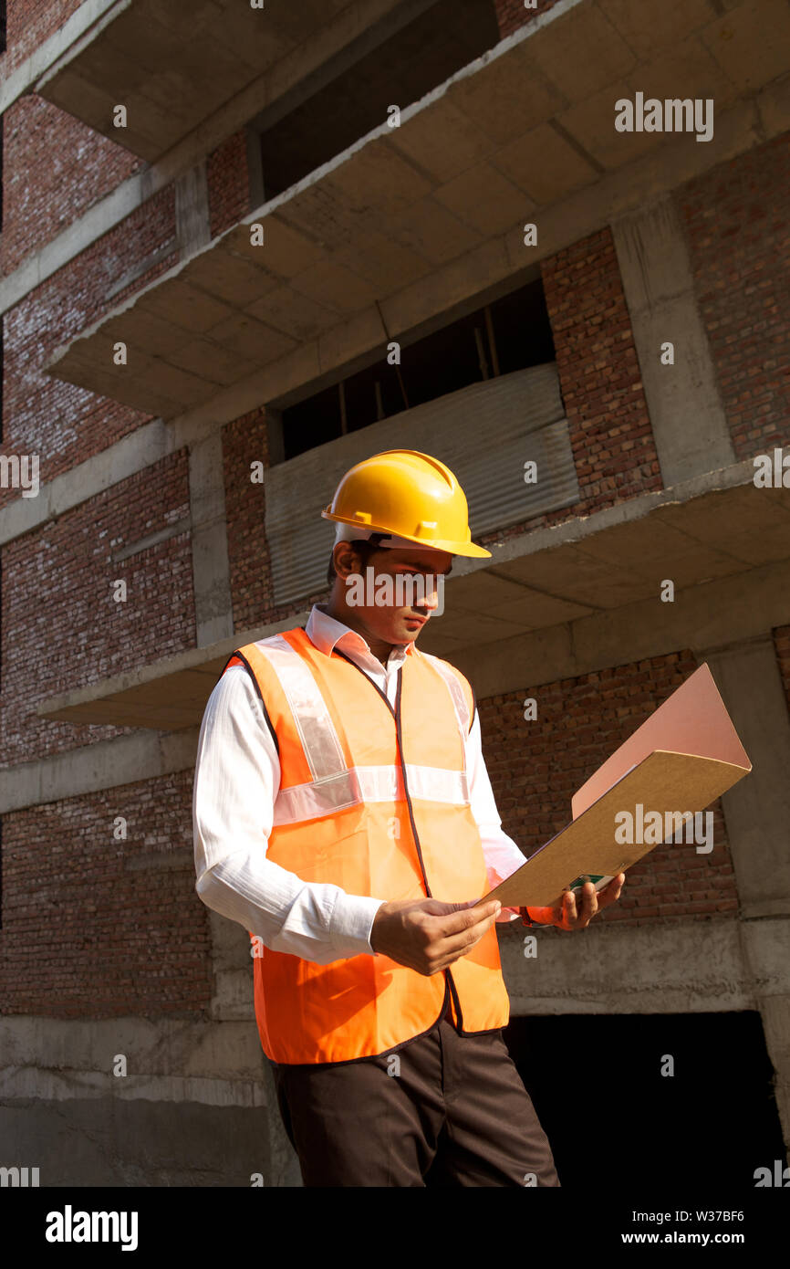 Architect doing paperwork Stock Photo - Alamy