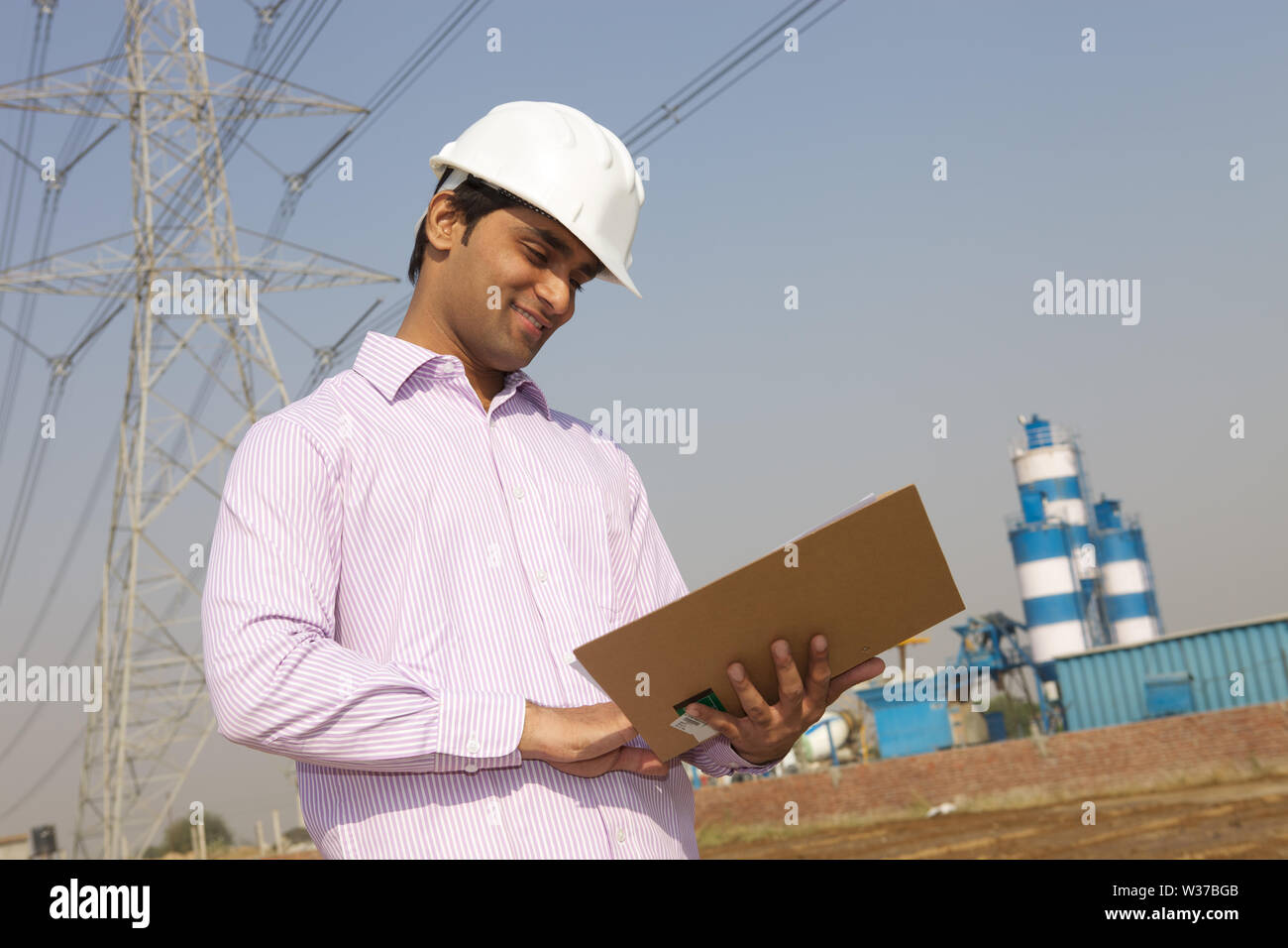 Engineer doing paperwork Stock Photo - Alamy