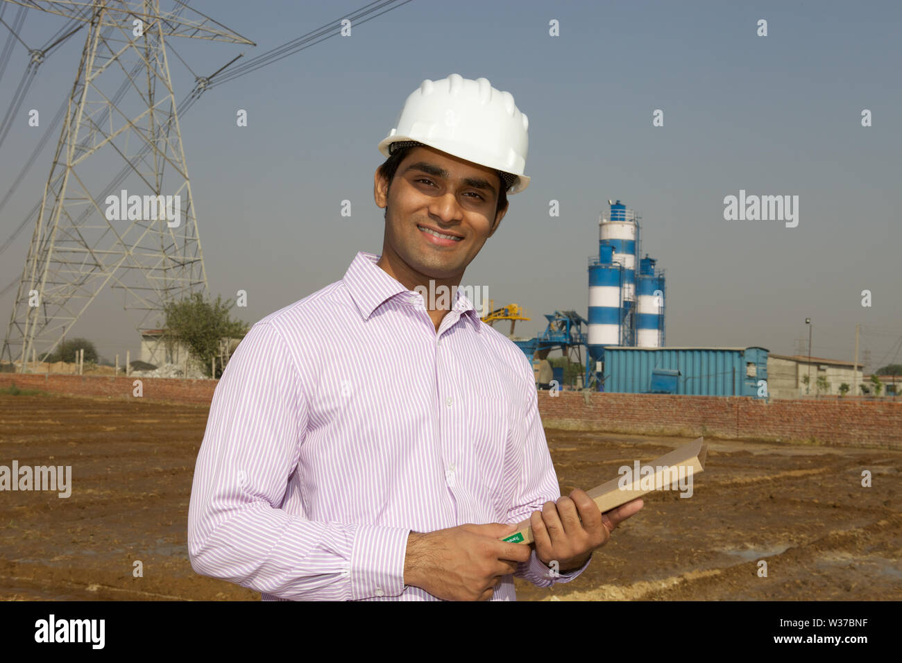Portrait of an engineer smiling Stock Photo - Alamy