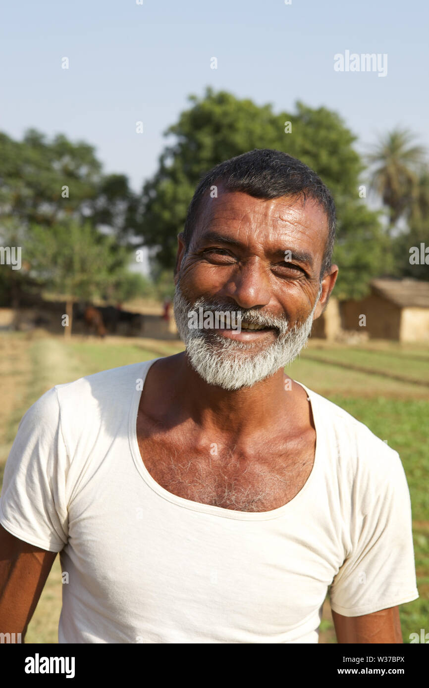 Portrait of a farmer smiling Stock Photo - Alamy