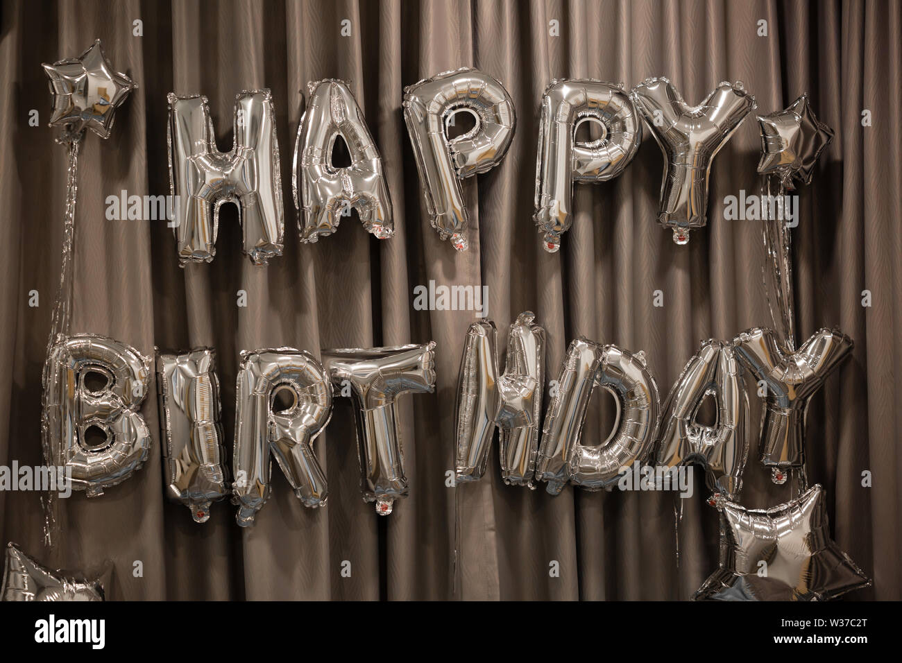 Silver balloon letters hi-res stock photography and images - Alamy