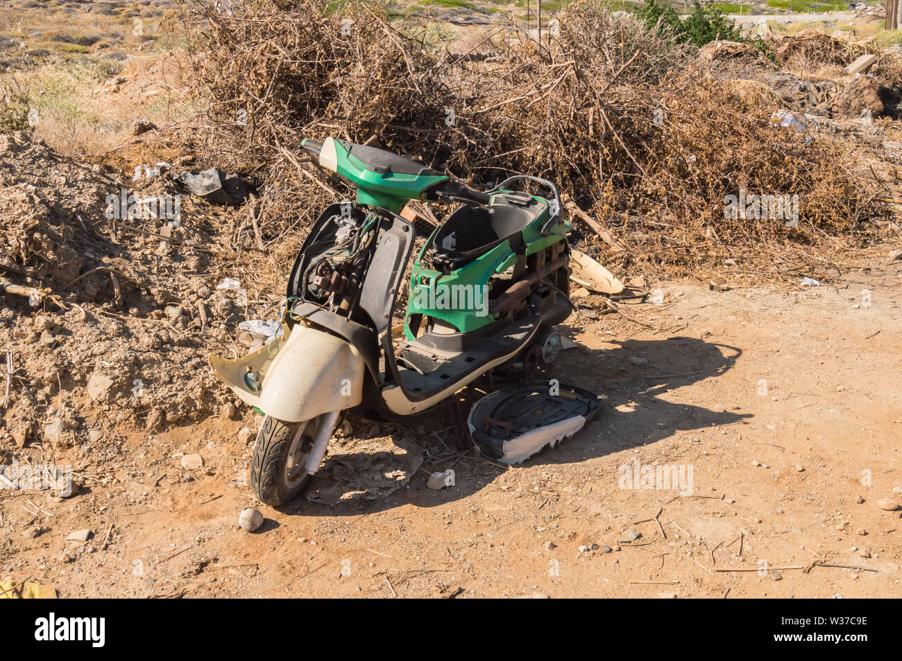 Old motorcycle destroyed. Old abandoned motorcycle in a deserted area ...