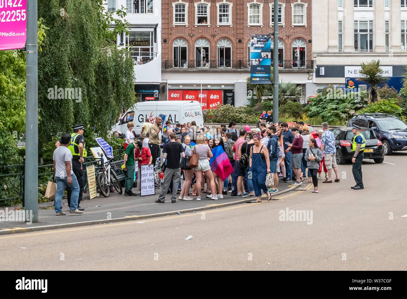 Bournemouth, UK. 13th July, 2019. A Christian street preacher uses an ...
