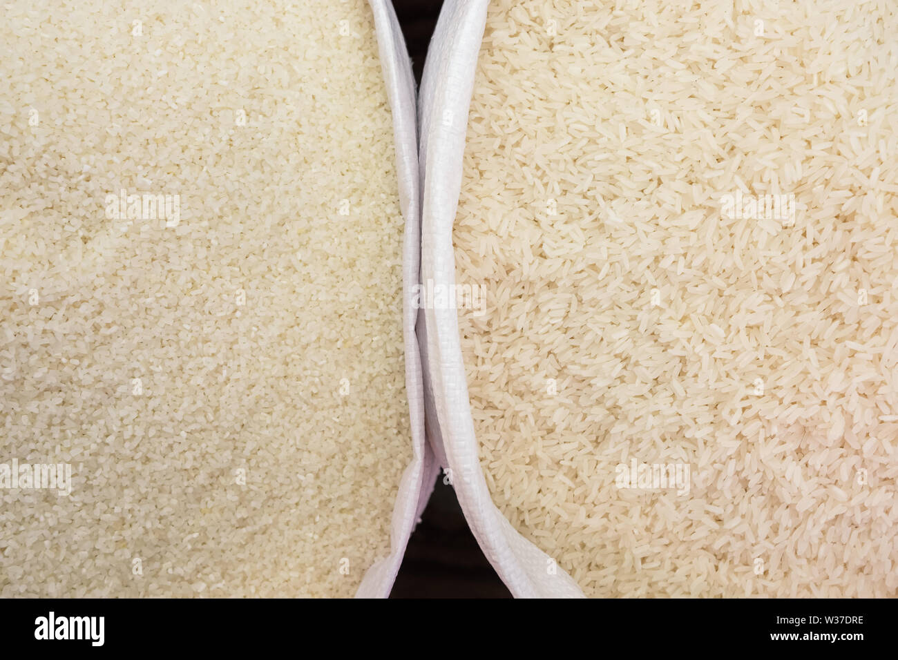 Short and long grain rice top view background. Rice stall at the market ...