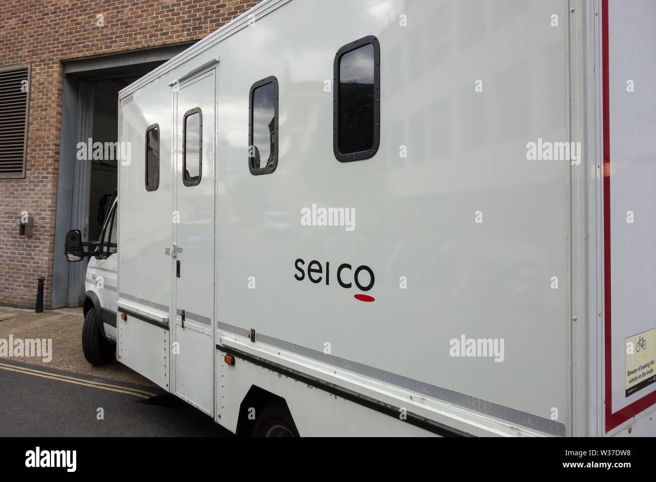 Close-up of a Serco Group plc prisoner transport van arriving at a ...