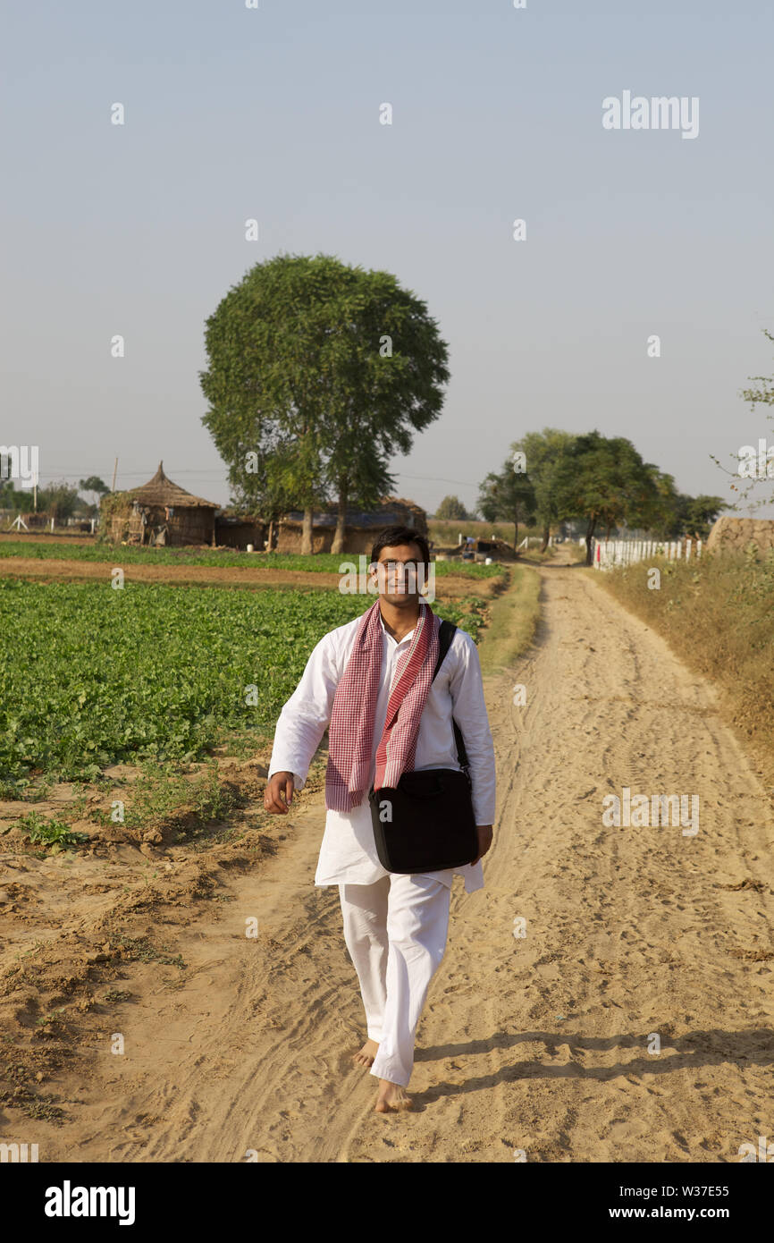 Indian village people walking with bag hi-res stock photography and ...