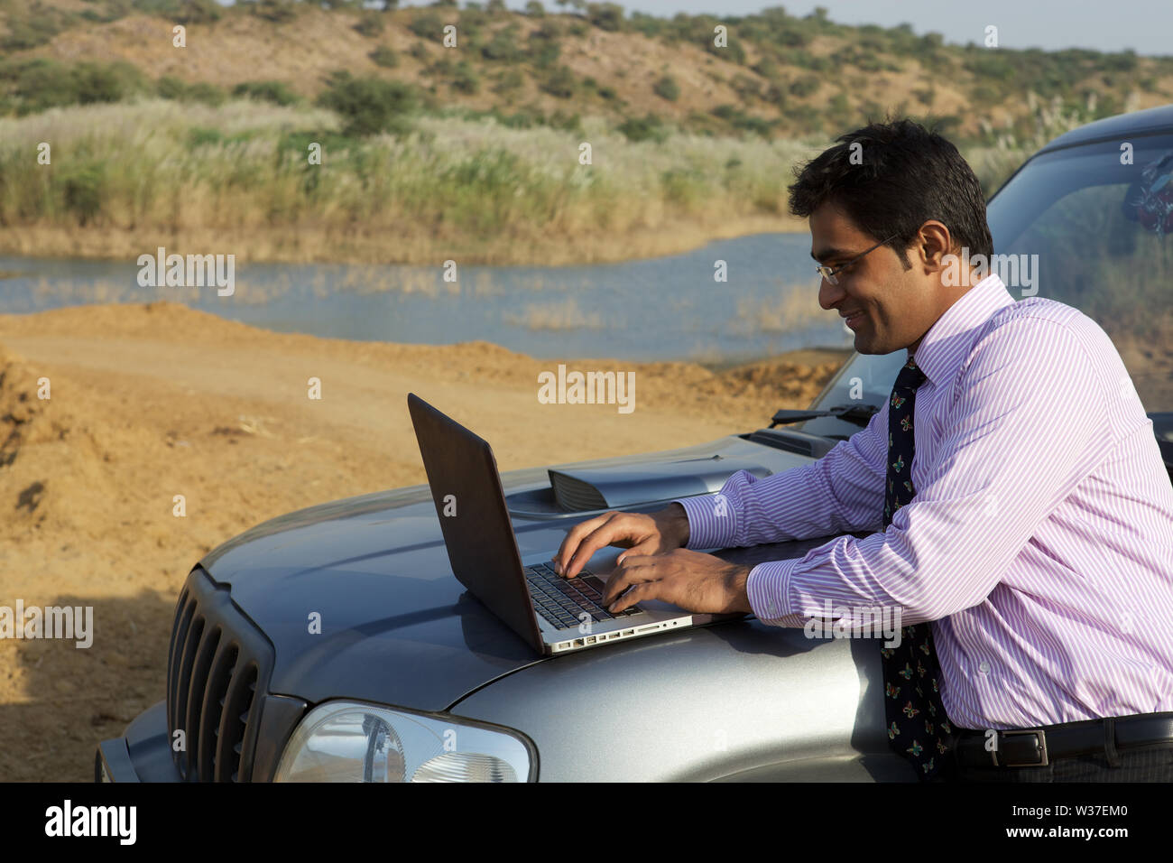 Laptop on hood of car hi-res stock photography and images - Alamy