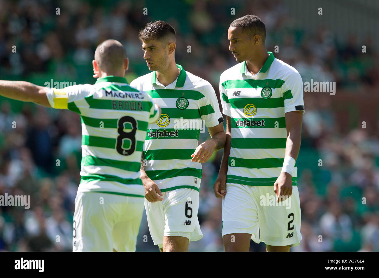 Celtic's Christopher Jullien (right) with Scott Brown and Nir Bitton ...
