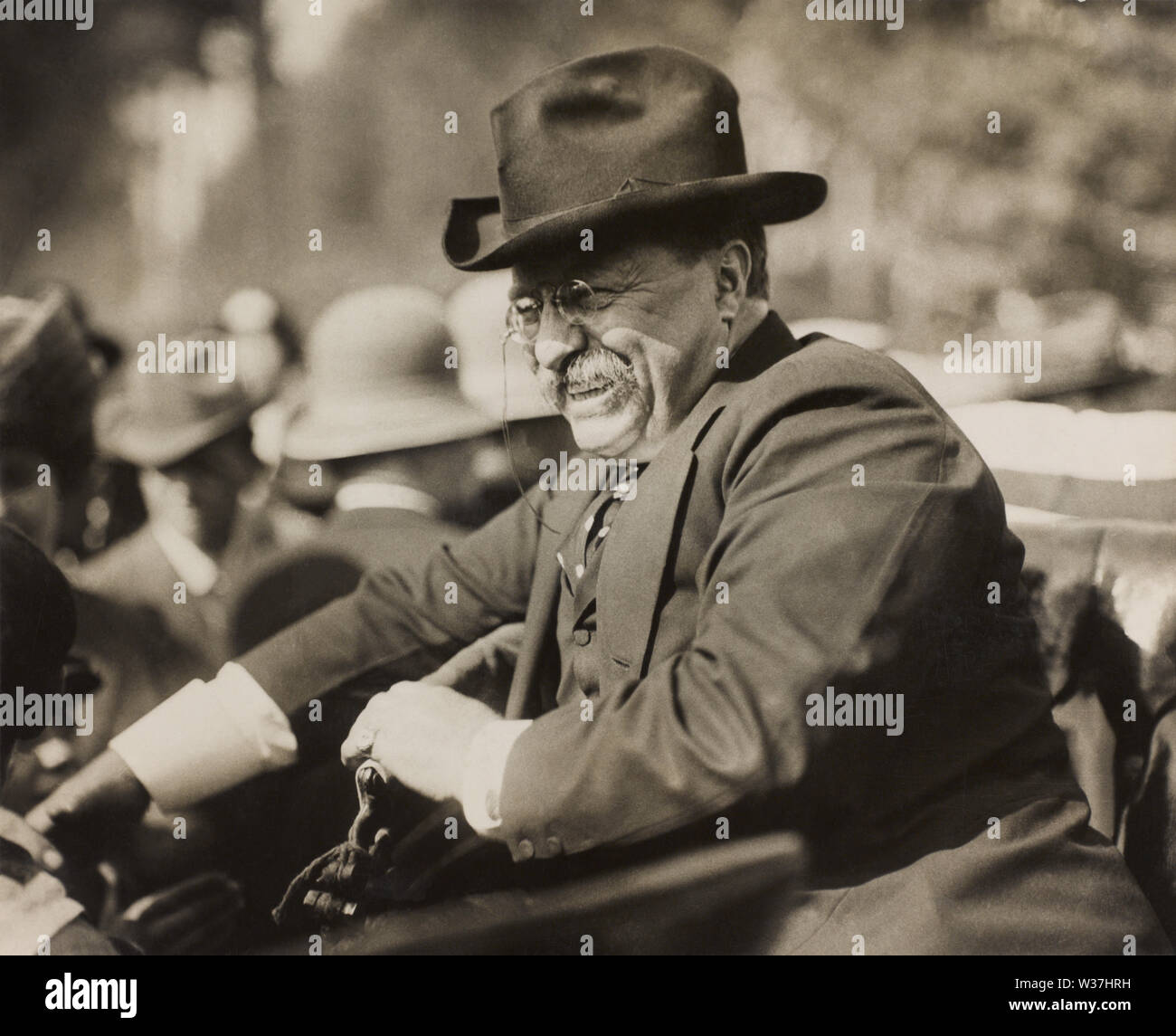 Photograph showing Theodore Roosevelt smiling from an automobile Stock ...