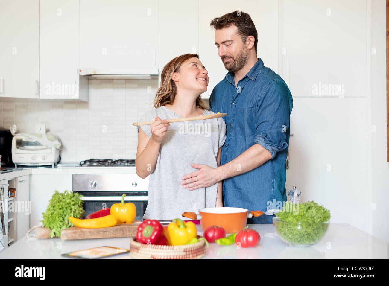 Lovers cooking together in kitchen hi-res stock photography and images ...