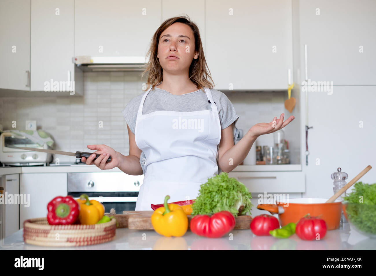 Stressed woman kitchen cooking hi-res stock photography and images - Alamy