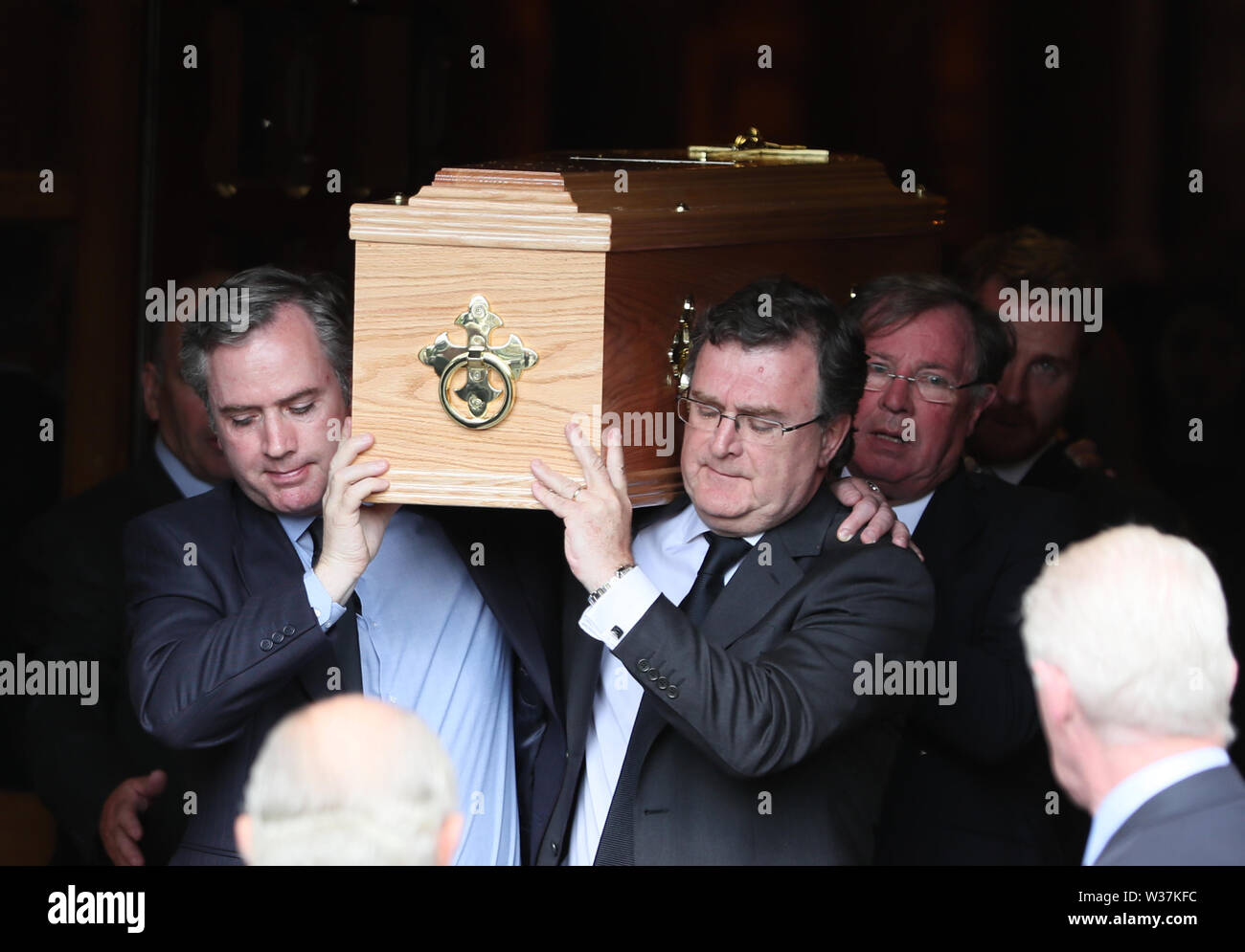 The coffin of Penneys/Primark founder Arthur Ryan is carried from the ...