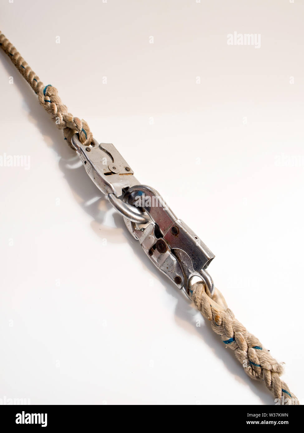 Safety hook pulling together with another hook Stock Photo - Alamy