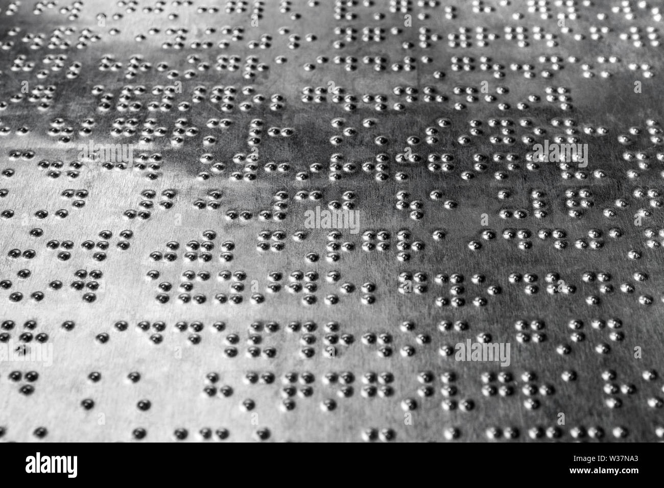 Braille code for the blind on the metal board for the detailed ...