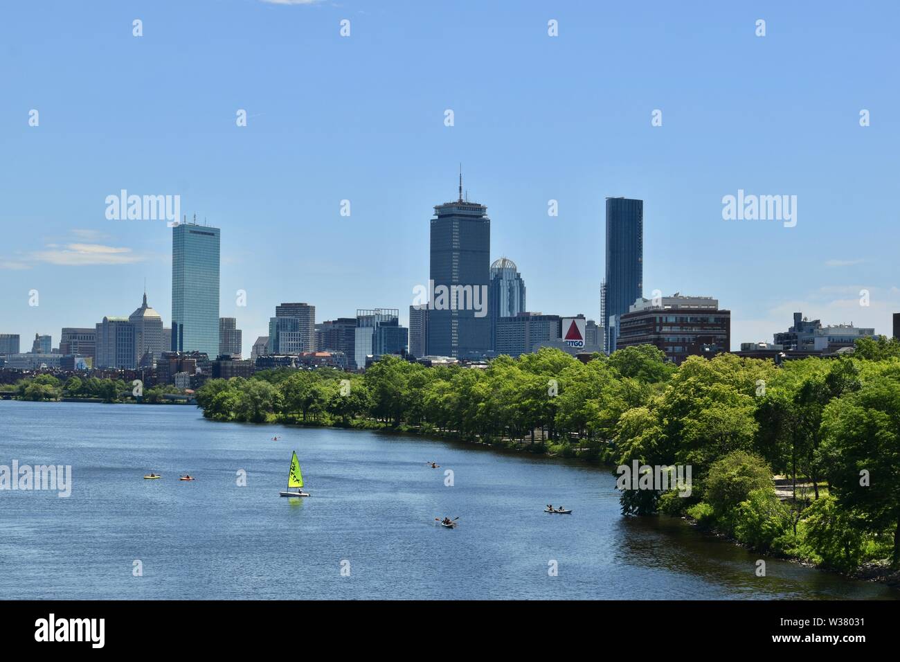 Sailboats sailing in the Charles River Basin with the Boston skyline ...