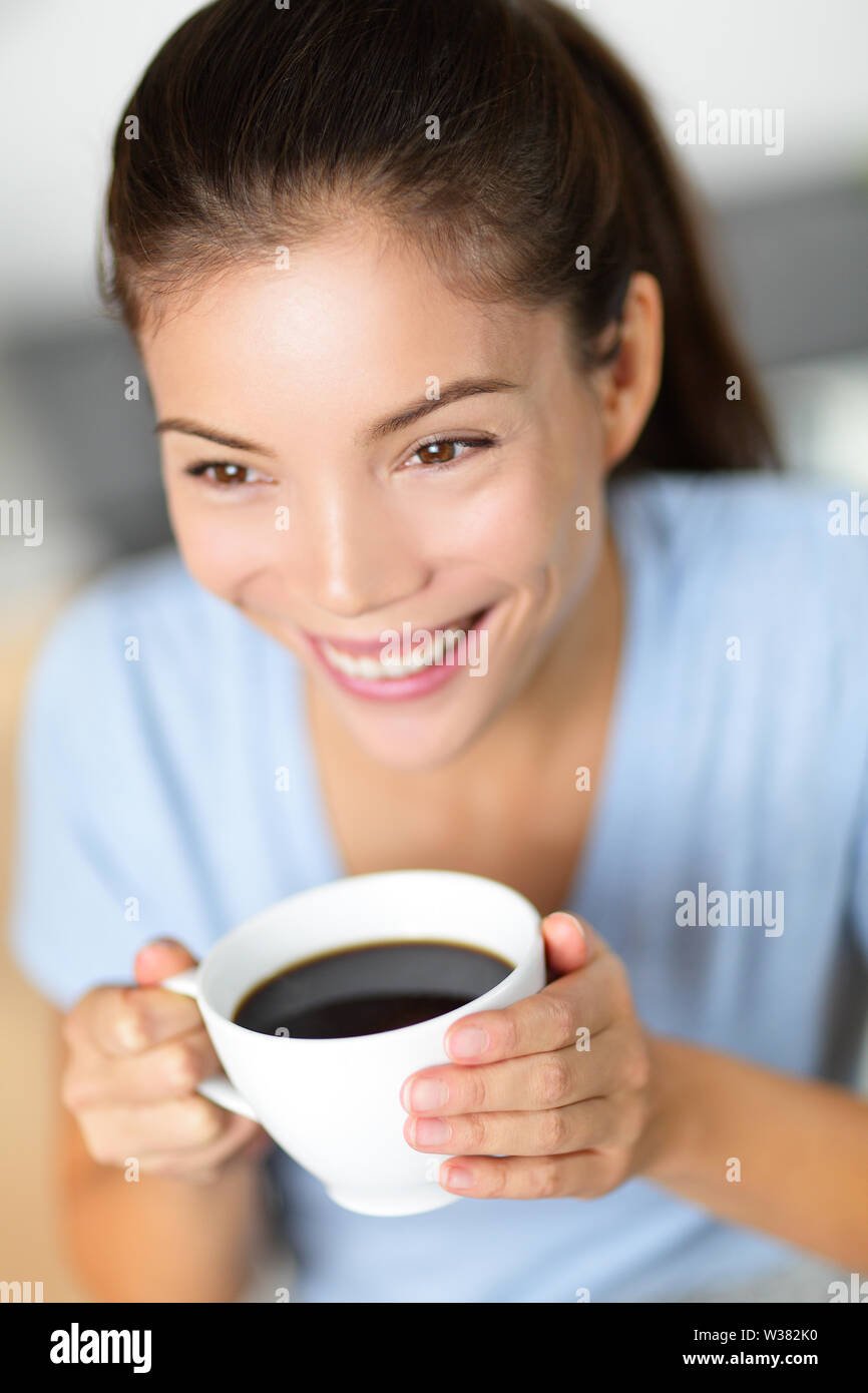 Asian chinese woman drinking coffee or black tea. Portrait of young ...