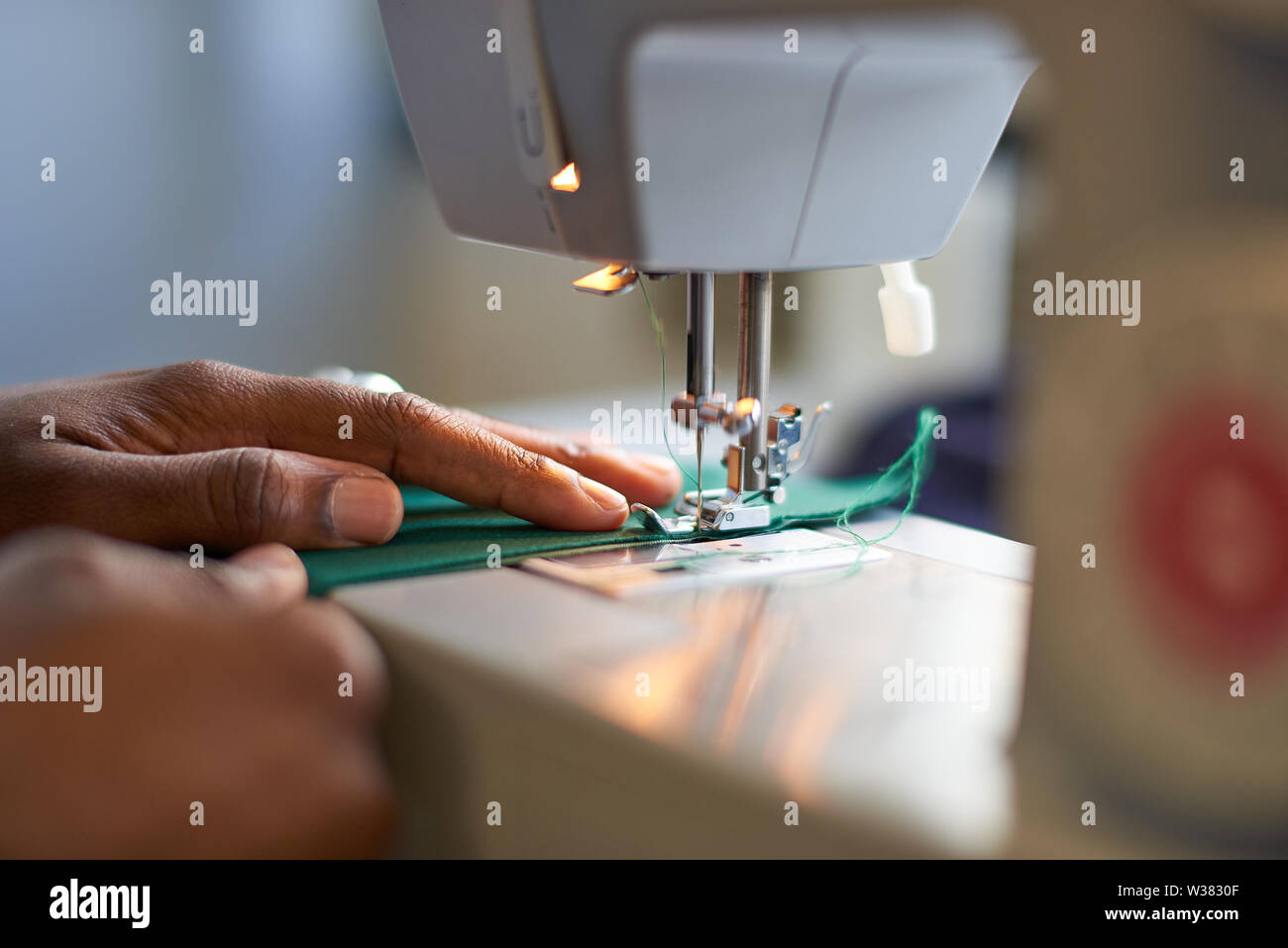 Hand sewing clothes hi-res stock photography and images - Alamy