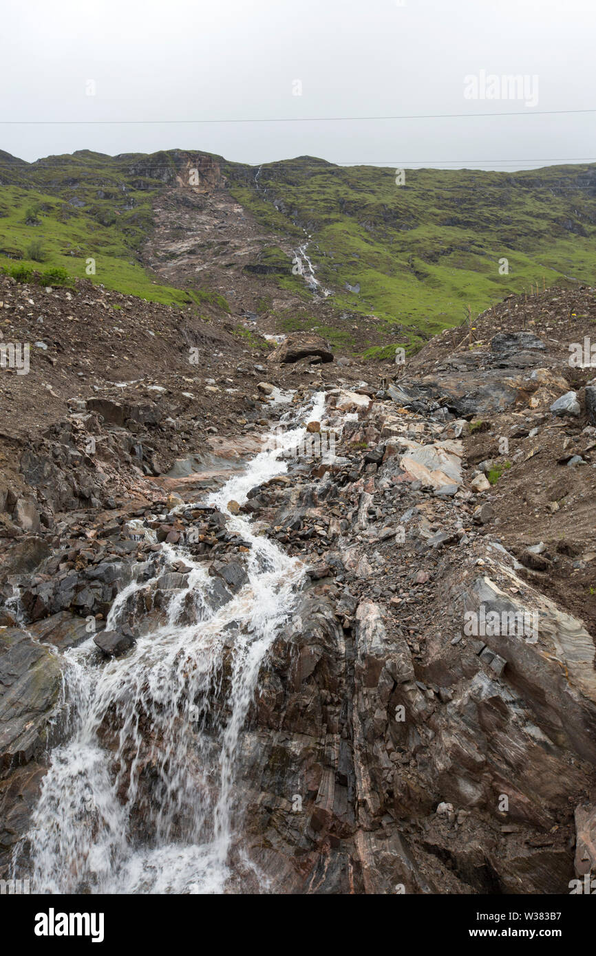 A massive landslide caused by a rockfall which blocked the road in Glen ...