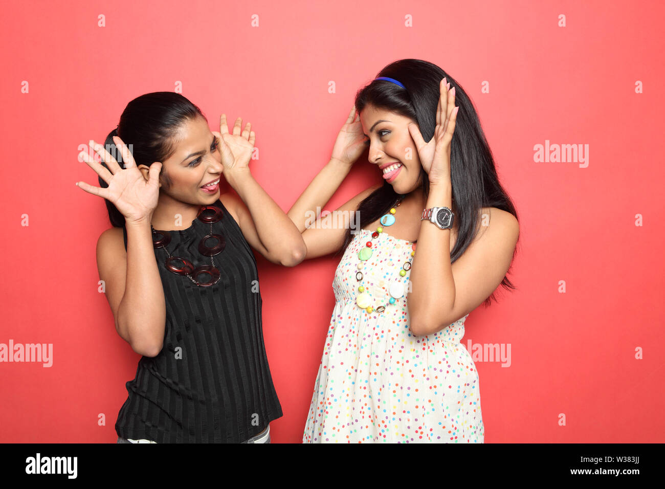 Two friends making funny faces Stock Photo - Alamy