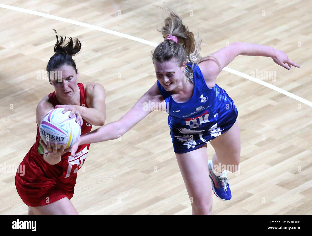 England's Rachel Dunn (left) and Scotland's Lauren Tait battle for the ...