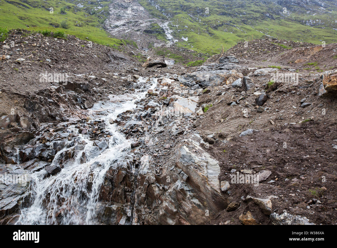 A massive landslide caused by a rockfall which blocked the road in Glen ...