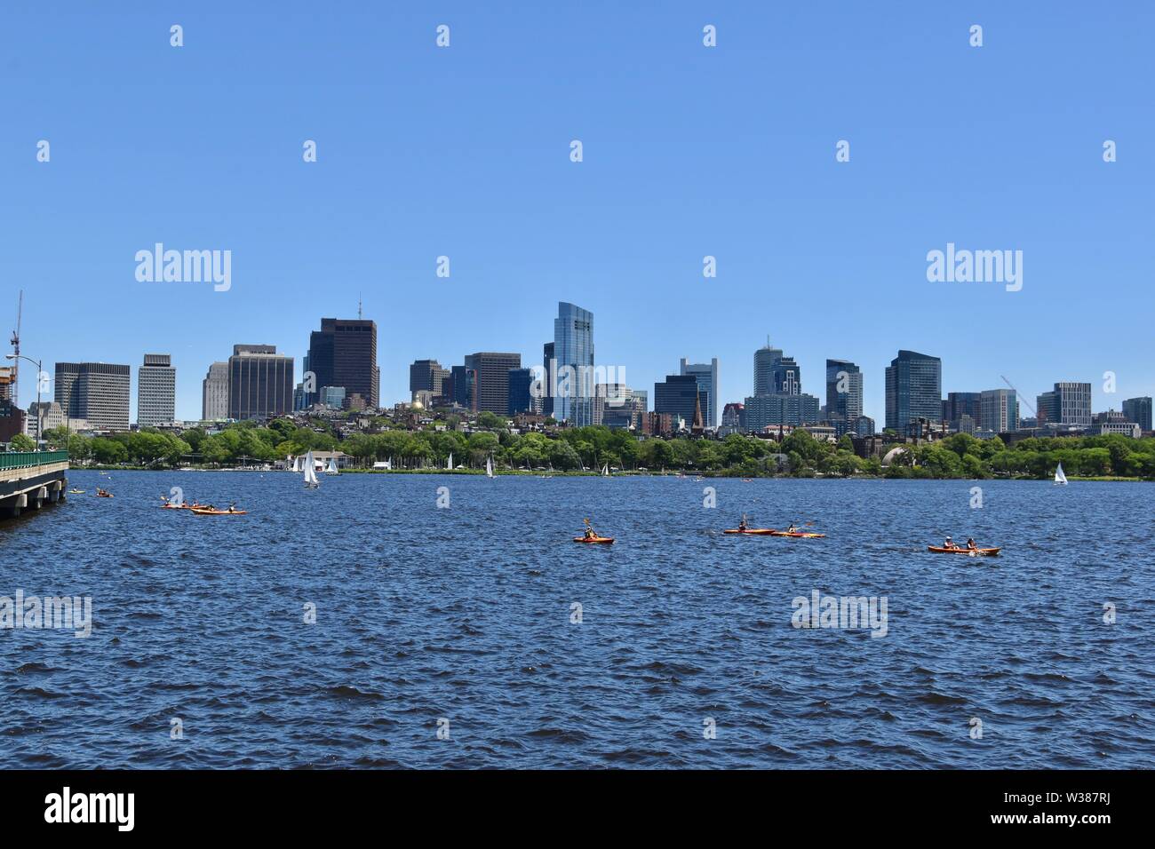 Sailboats sailing in the Charles River Basin with the Boston skyline ...