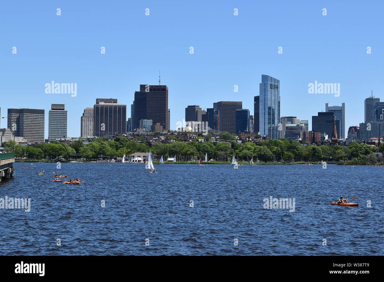 Sailboats sailing in the Charles River Basin with the Boston skyline ...