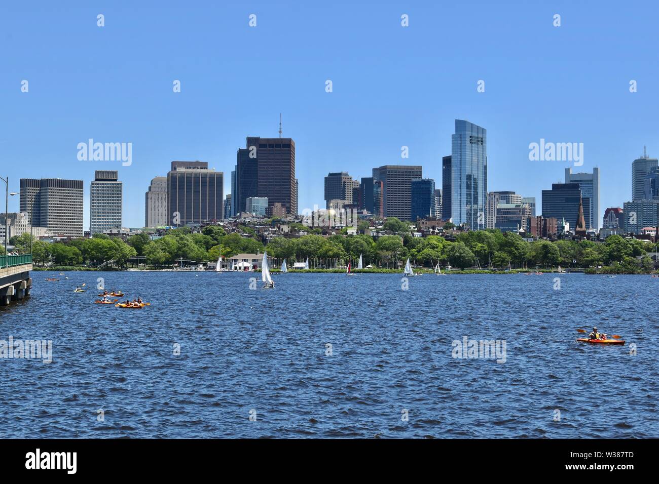 Sailboats sailing in the Charles River Basin with the Boston skyline ...