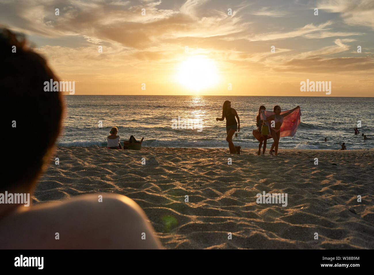 Sunset on beach Stock Photo - Alamy